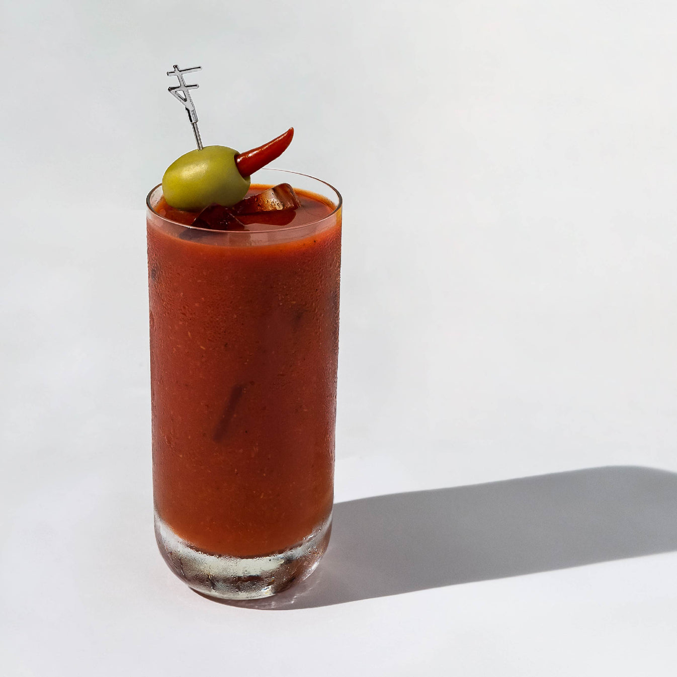 Filthy Pepper Stuffed Olives - Premium cocktail garnishes.